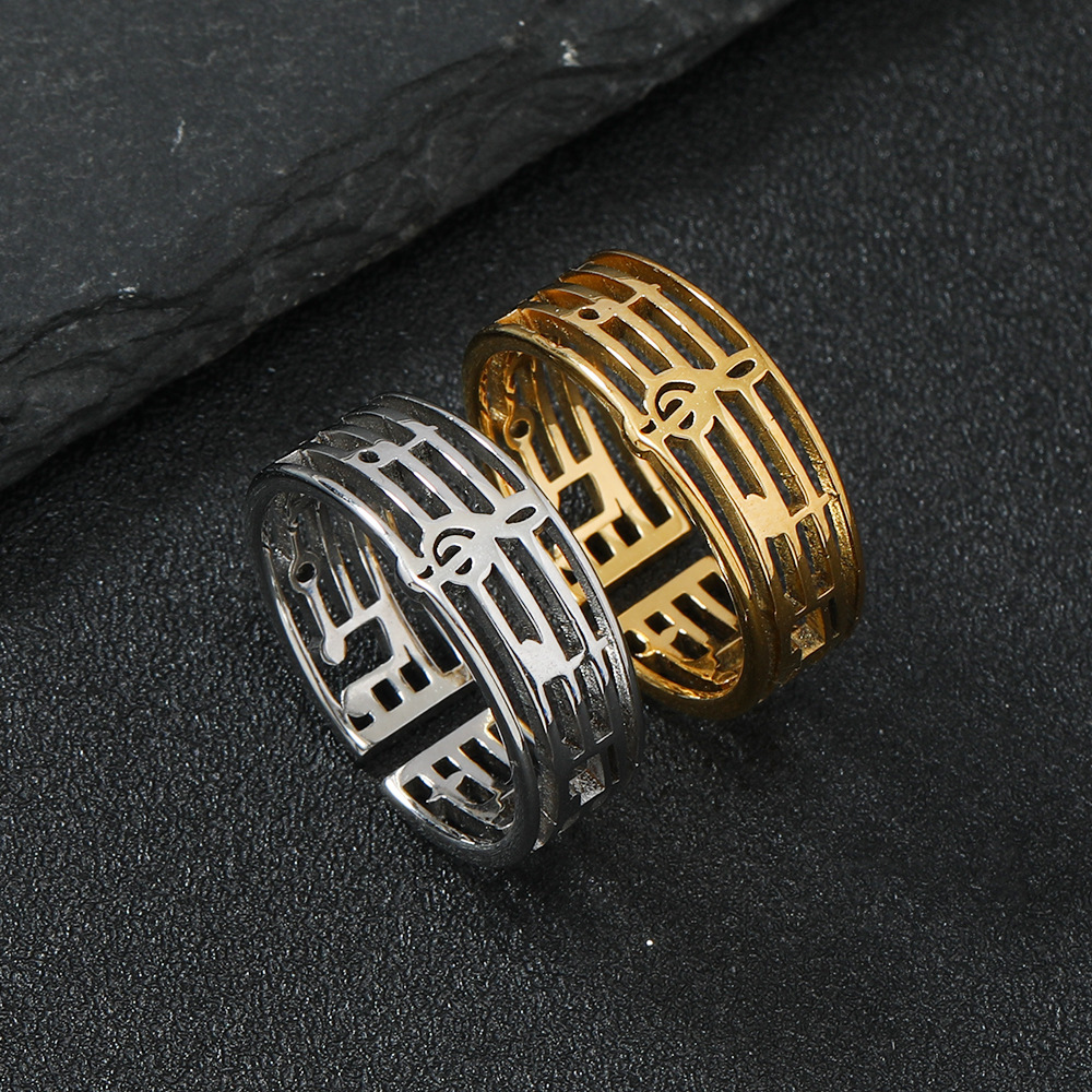 Fashion personality titanium steel ring men and women's hollow staff ...
