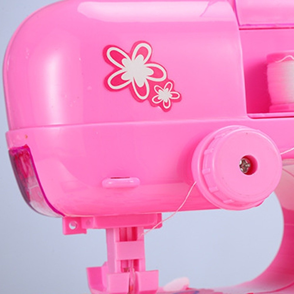 Small Simulated Children Sewing Machine Making Clothes with Light ...